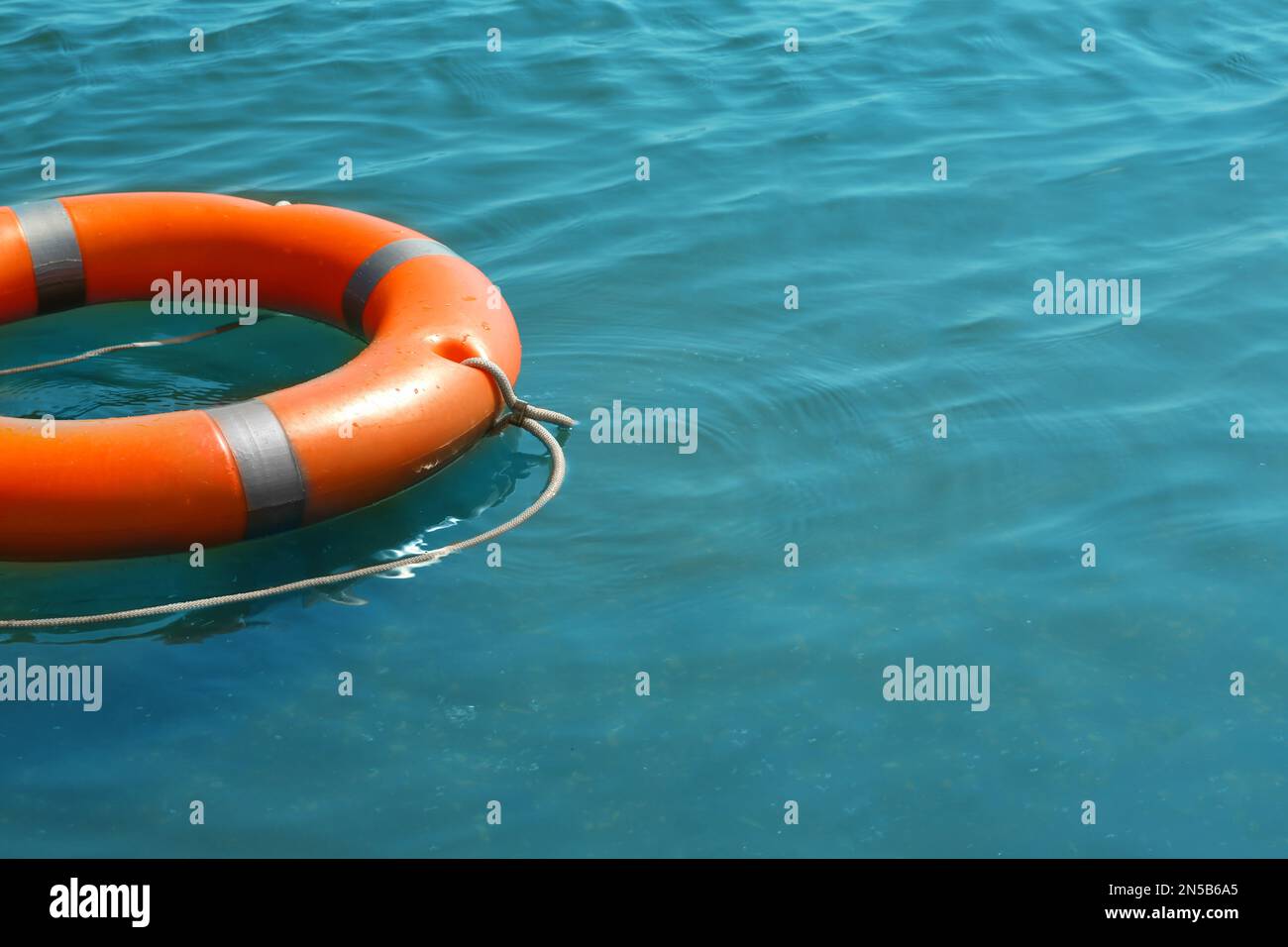 Orange life buoy floating in sea. Emergency rescue equipment Stock ...