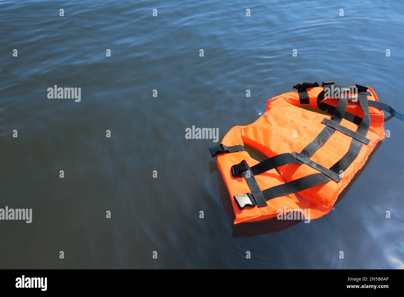 Orange life jacket floating in sea. Emergency rescue equipment Stock ...