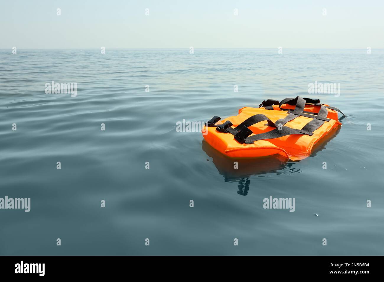 Orange life jacket floating in sea. Emergency rescue equipment Stock ...