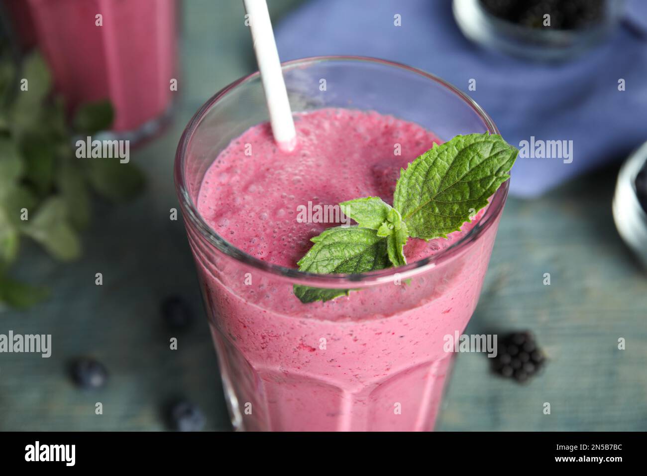 Tasty fresh milk shake with mint on table, closeup Stock Photo - Alamy