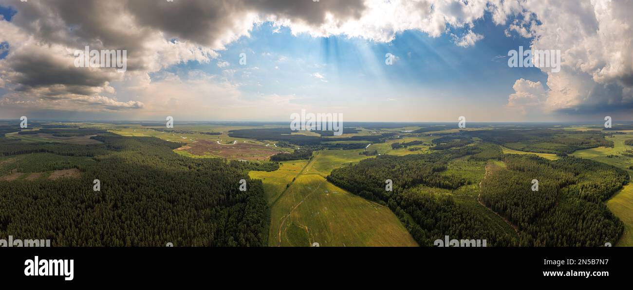 Sunny countryside with sun rays summer landscape aerial panorama. View ...