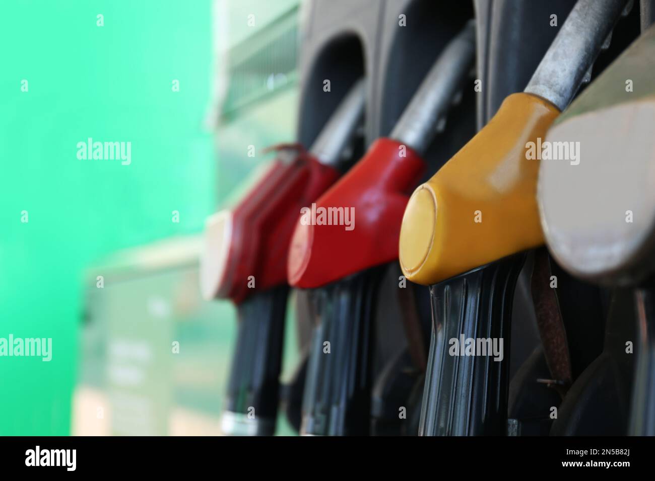Closeup view of pump nozzles at gas station Stock Photo - Alamy