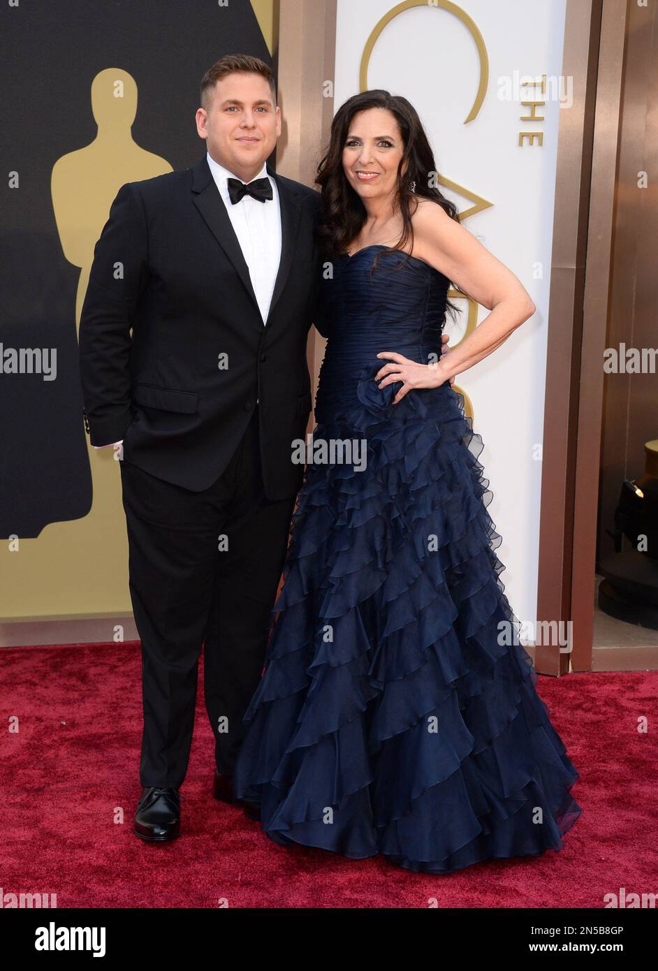 Jonah Hill, left, and Sharon Lyn Chalkin arrive at the Oscars on Sunday ...