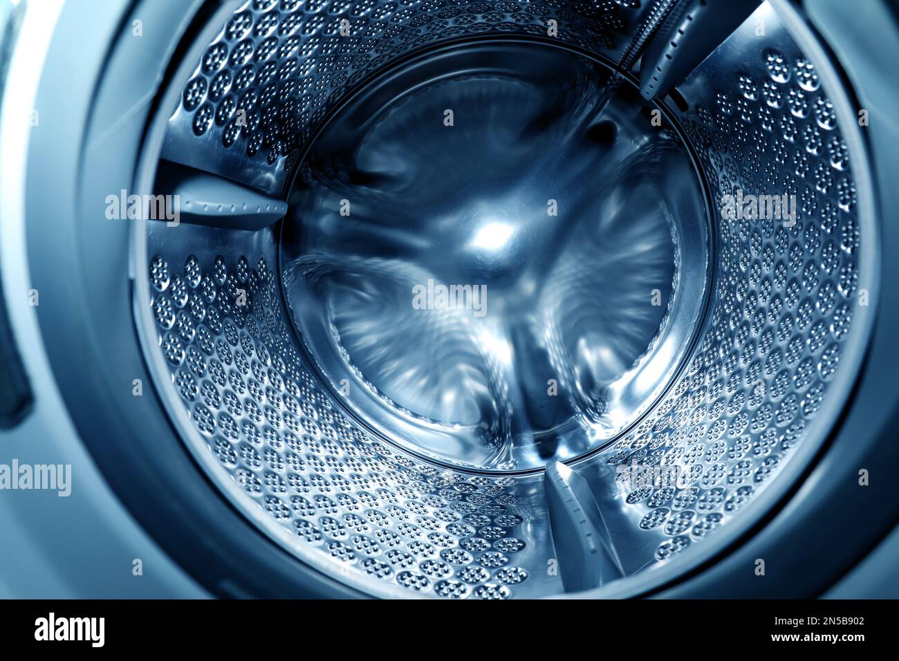 Empty washing machine drum, closeup. Laundry day Stock Photo - Alamy