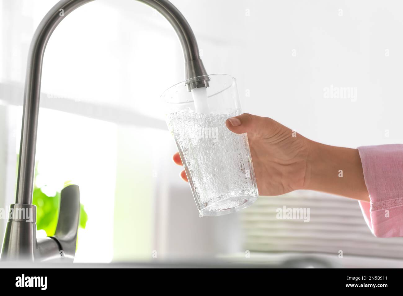 Closeup water pouring filling transparent hi-res stock photography and ...