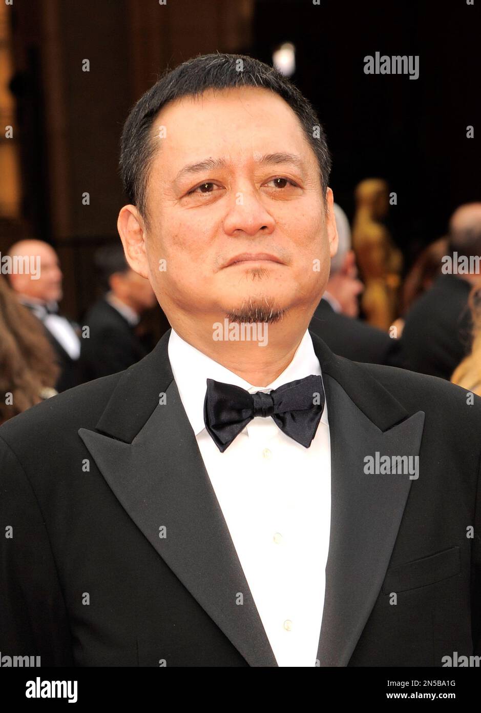 William Chang Suk Ping arrives at the Oscars on Sunday, March 2, 2014 ...