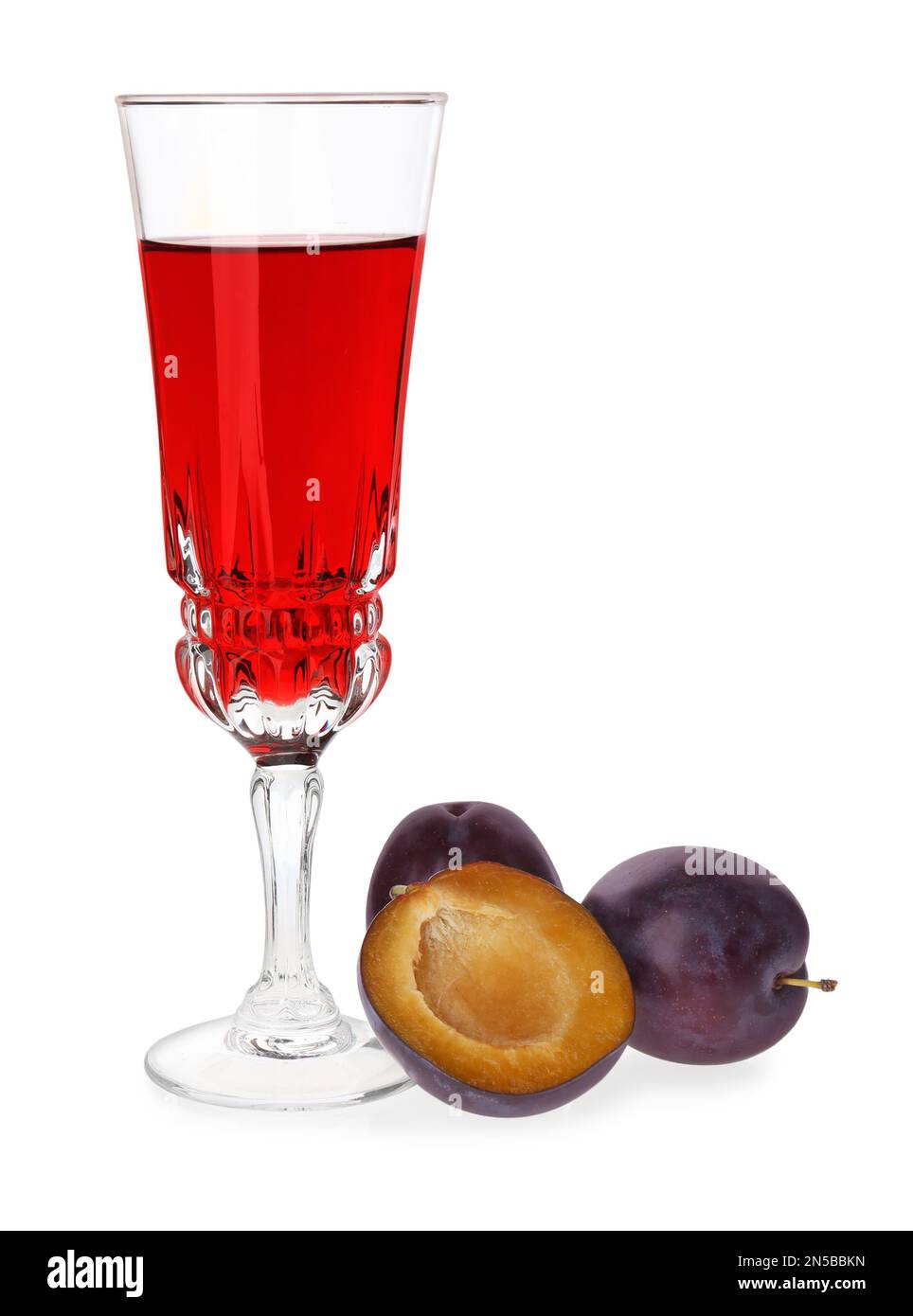 Delicious plum liquor and ripe fruits on white background. Homemade ...