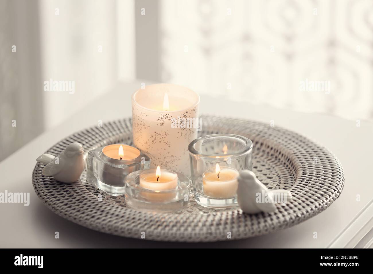 Tray beautiful burning candles hi-res stock photography and images - Alamy