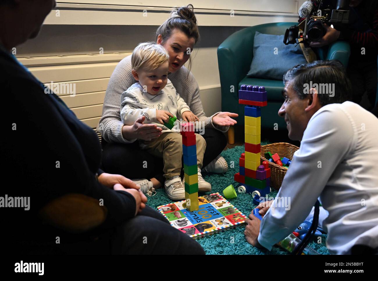 Prime Minister Rishi Sunak speaks with Giselle (centre) the mother of ...