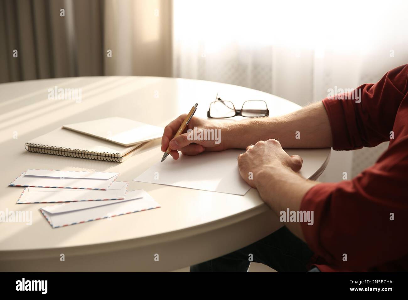 Simple beautiful man writing hi-res stock photography and images - Alamy
