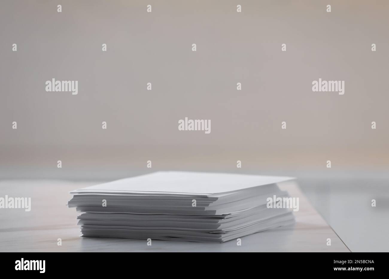Stack of blank paper sheets on table in office, closeup Stock Photo - Alamy