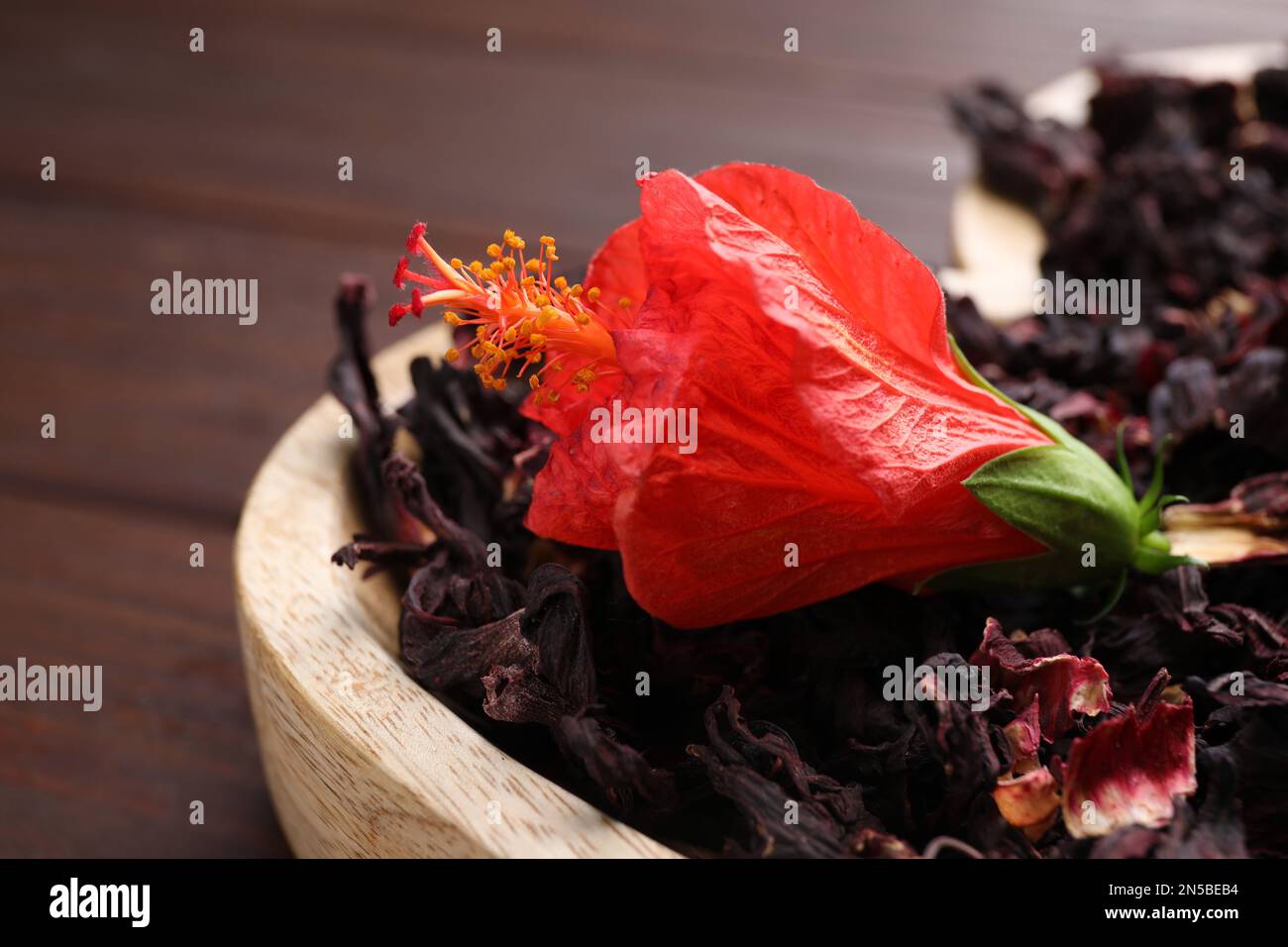 Dry hibiscus tea and beautiful flower on tray, closeup Stock Photo - Alamy