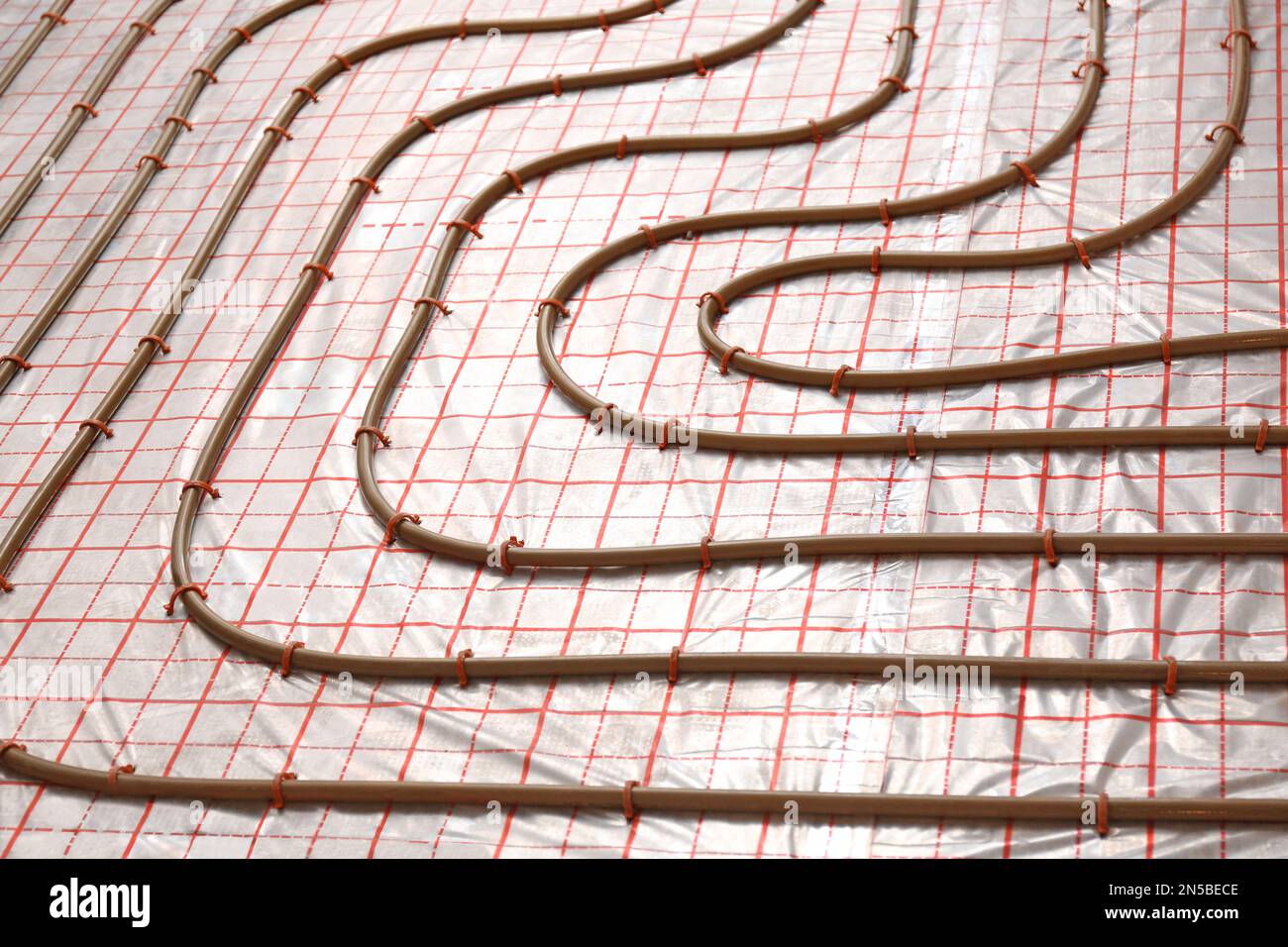 Installation of underfloor heating system in building Stock Photo - Alamy