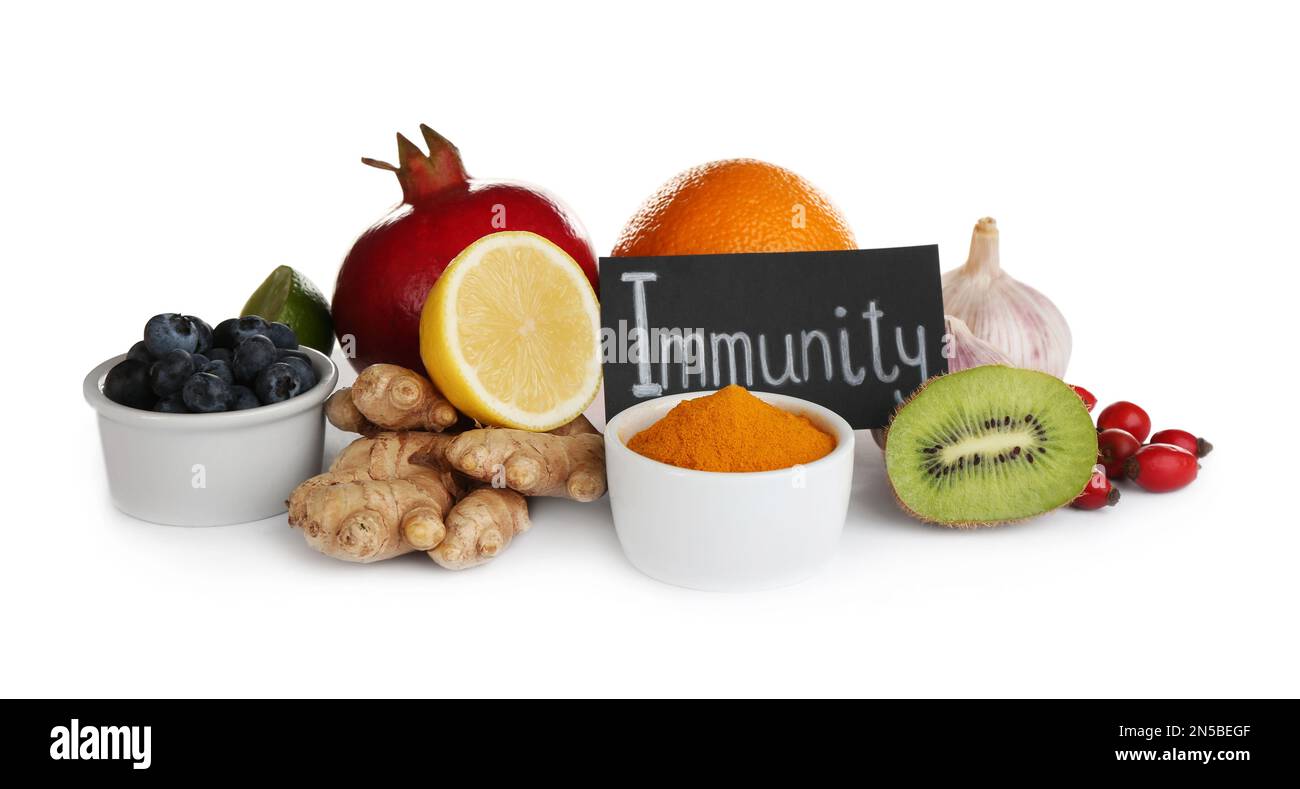 Set of natural products and card with word Immunity on white background ...