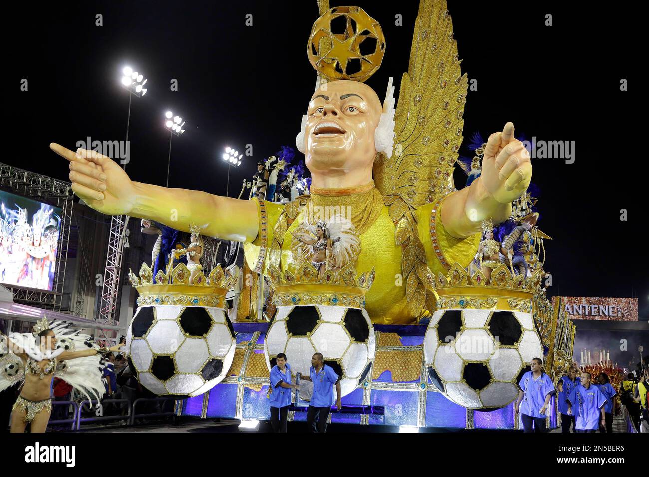 Dancers perform on a float depicting Brazil's former soccer player ...