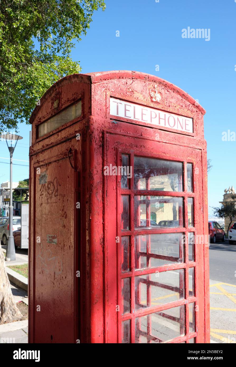 Red phone box in the street in Malta Stock Photo - Alamy