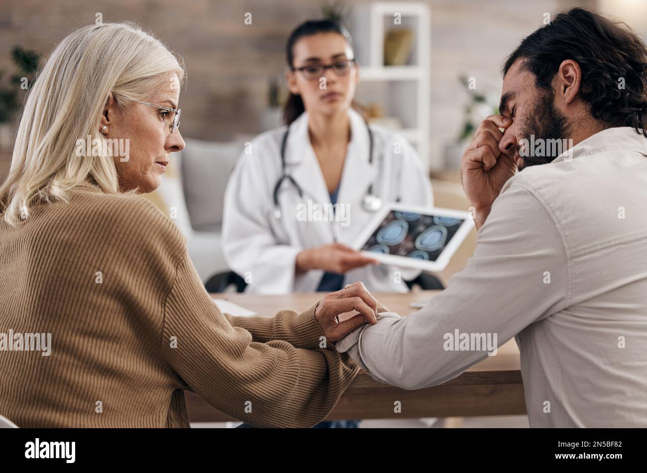 Neurology, fear and doctor with mother and son, mri brain scan or x ray ...
