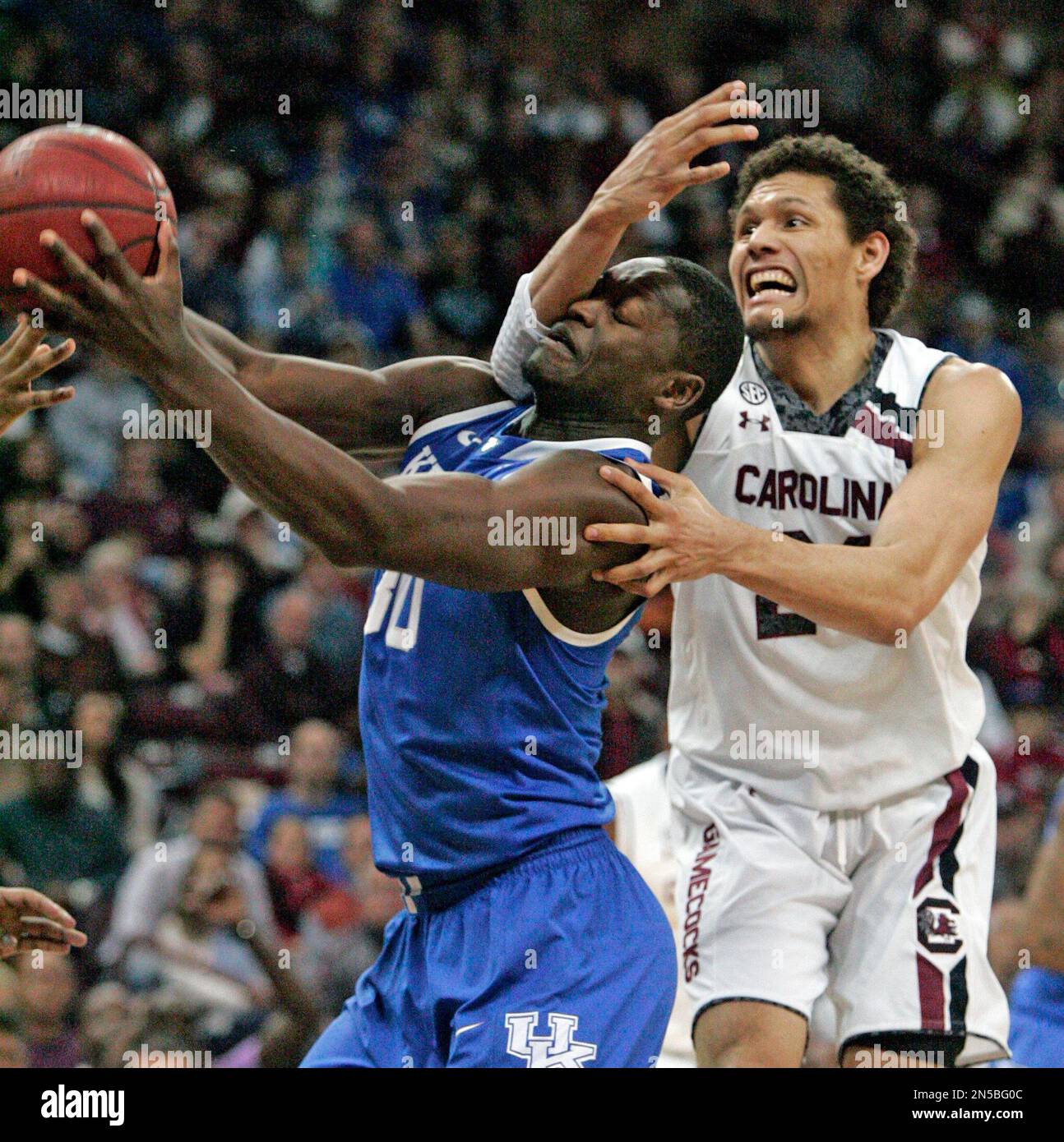 Kentucky's Julius Randle (30) is fouled as South Carolina's Michael ...