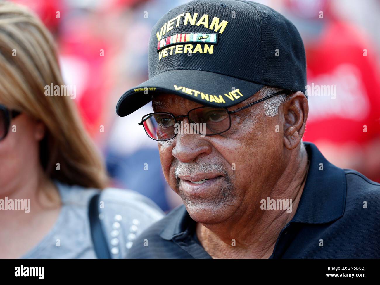 U.S. Army Sgt. 1st Class Melvin Morris, Ret., stands on the field ...