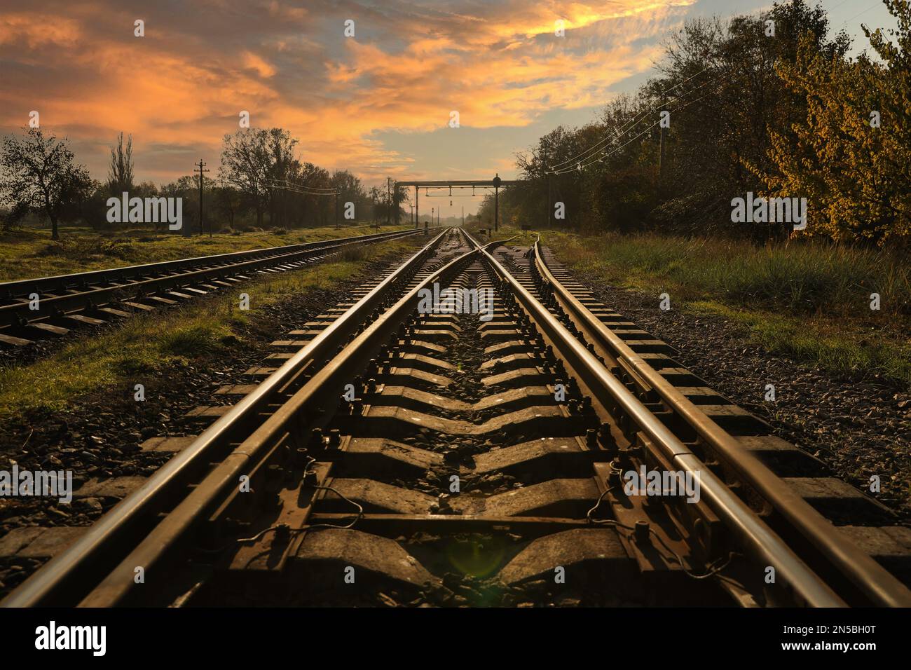 Railway lines in countryside on sunny day. Train journey Stock Photo ...