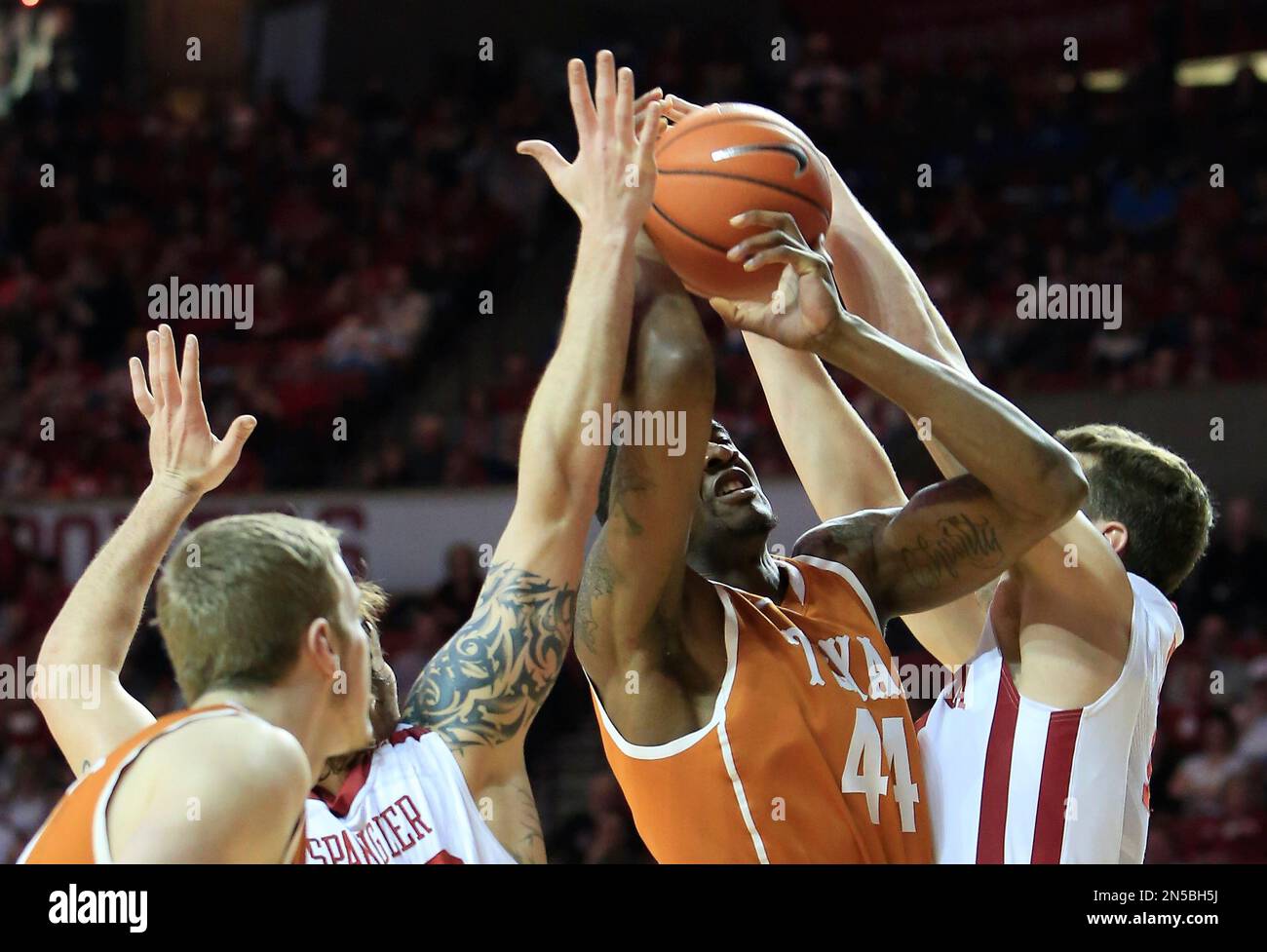 Oklahoma forward Tyler Neal, right, and forward Ryan Spangler defend as ...