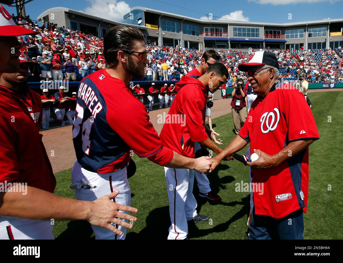 Washington Nationals' Bryce Harper (34) shakes hands with U.S. Army Sgt ...
