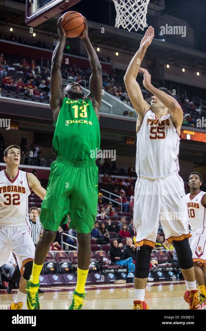 Oregon guard Brett Brady, left, goes up against Southern California ...