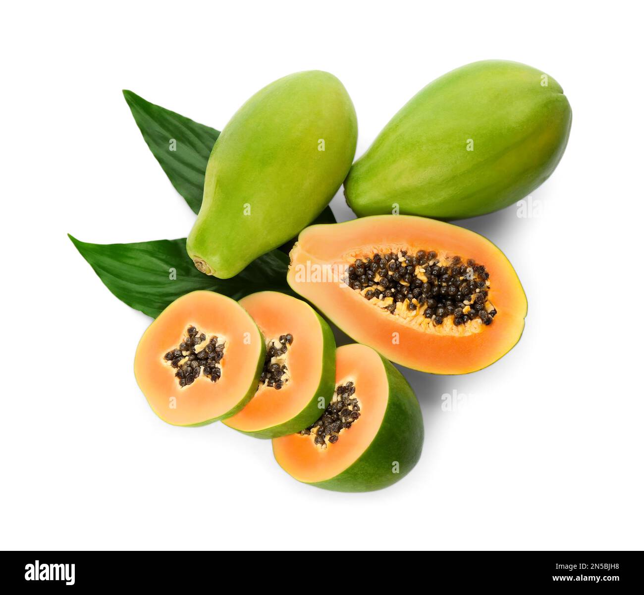 Fresh ripe papaya fruits with green leaves on white background Stock ...