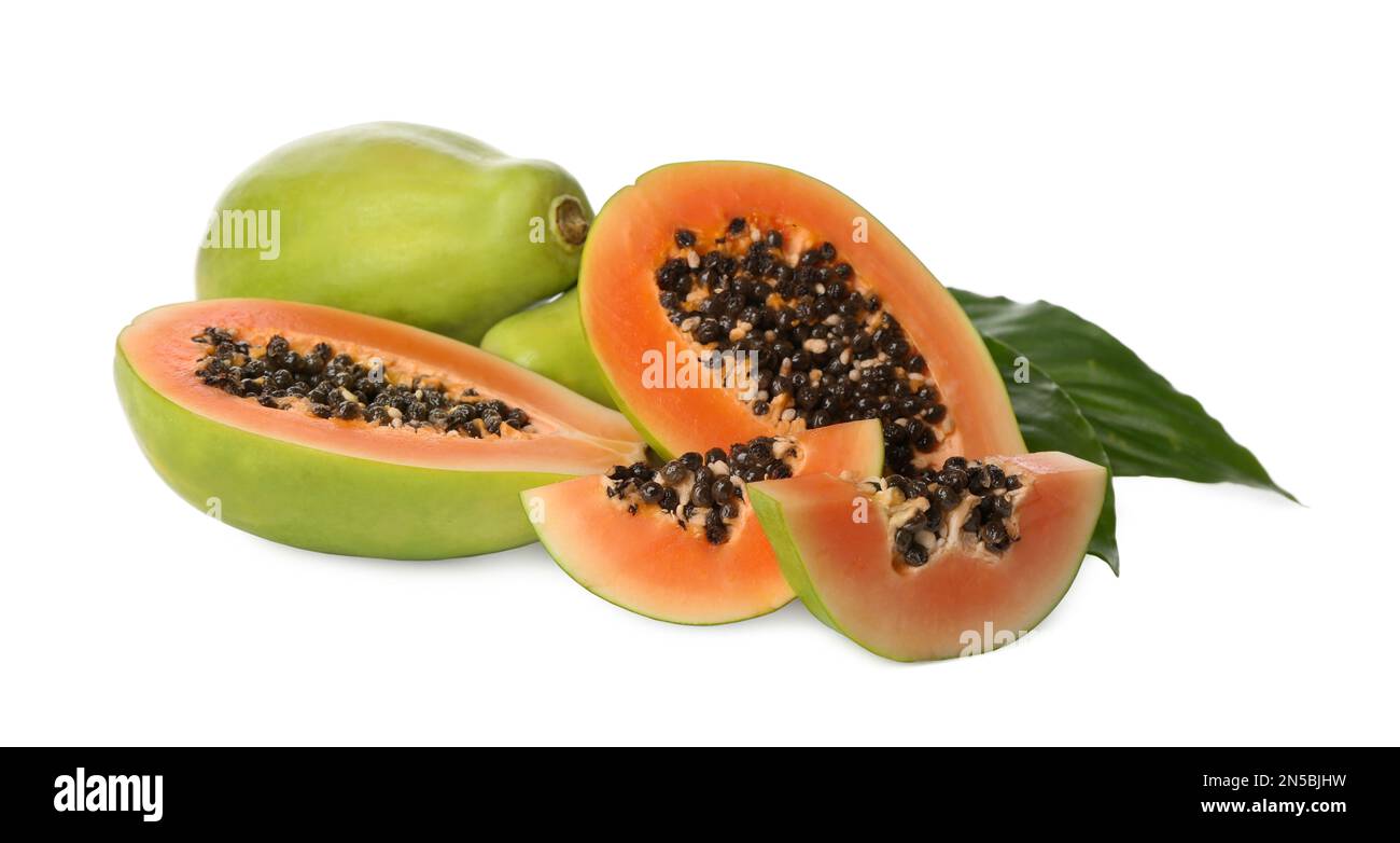 Fresh ripe papaya fruits with green leaves on white background Stock ...