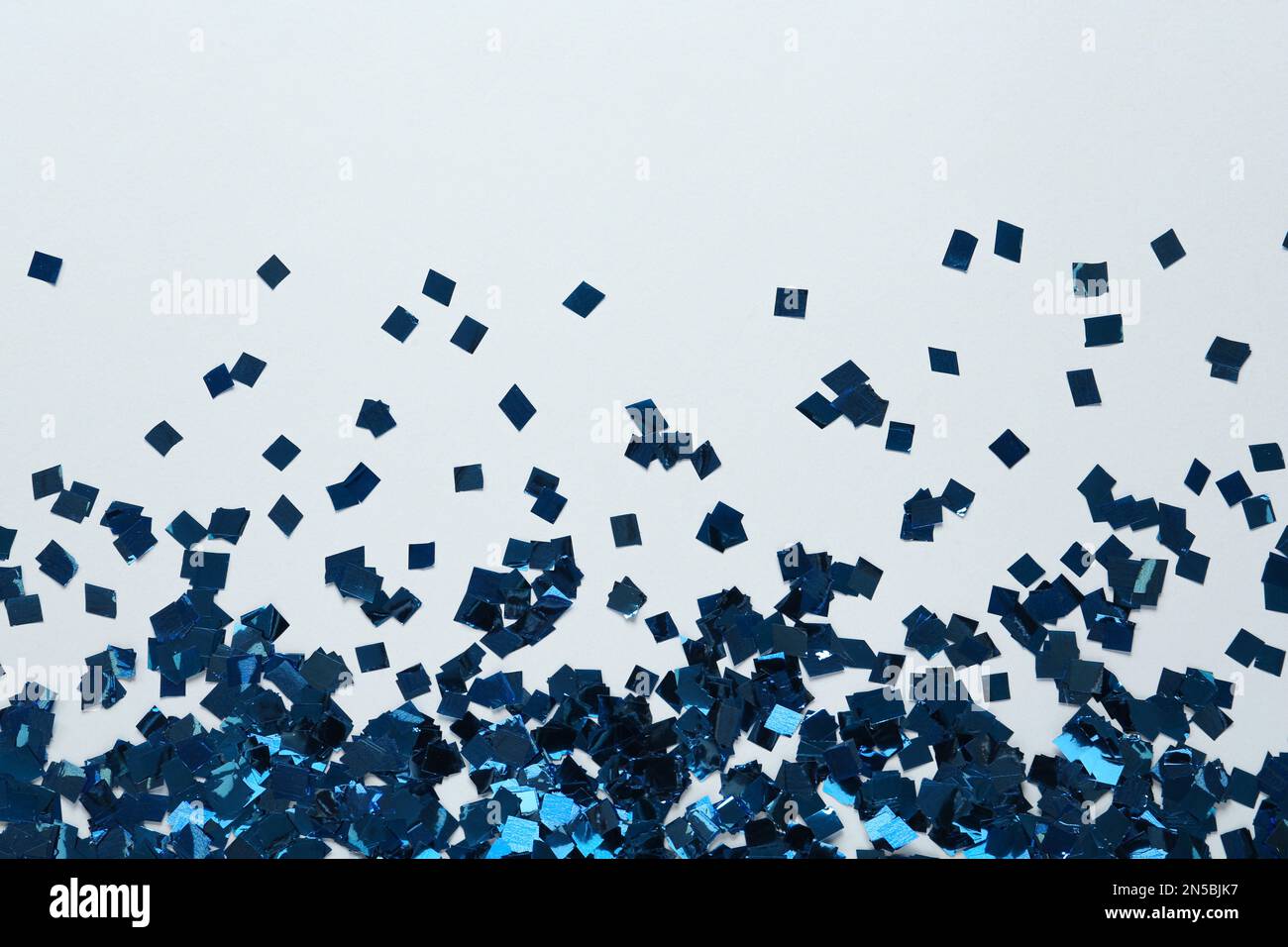 Shiny blue confetti on light grey background, flat lay Stock Photo - Alamy