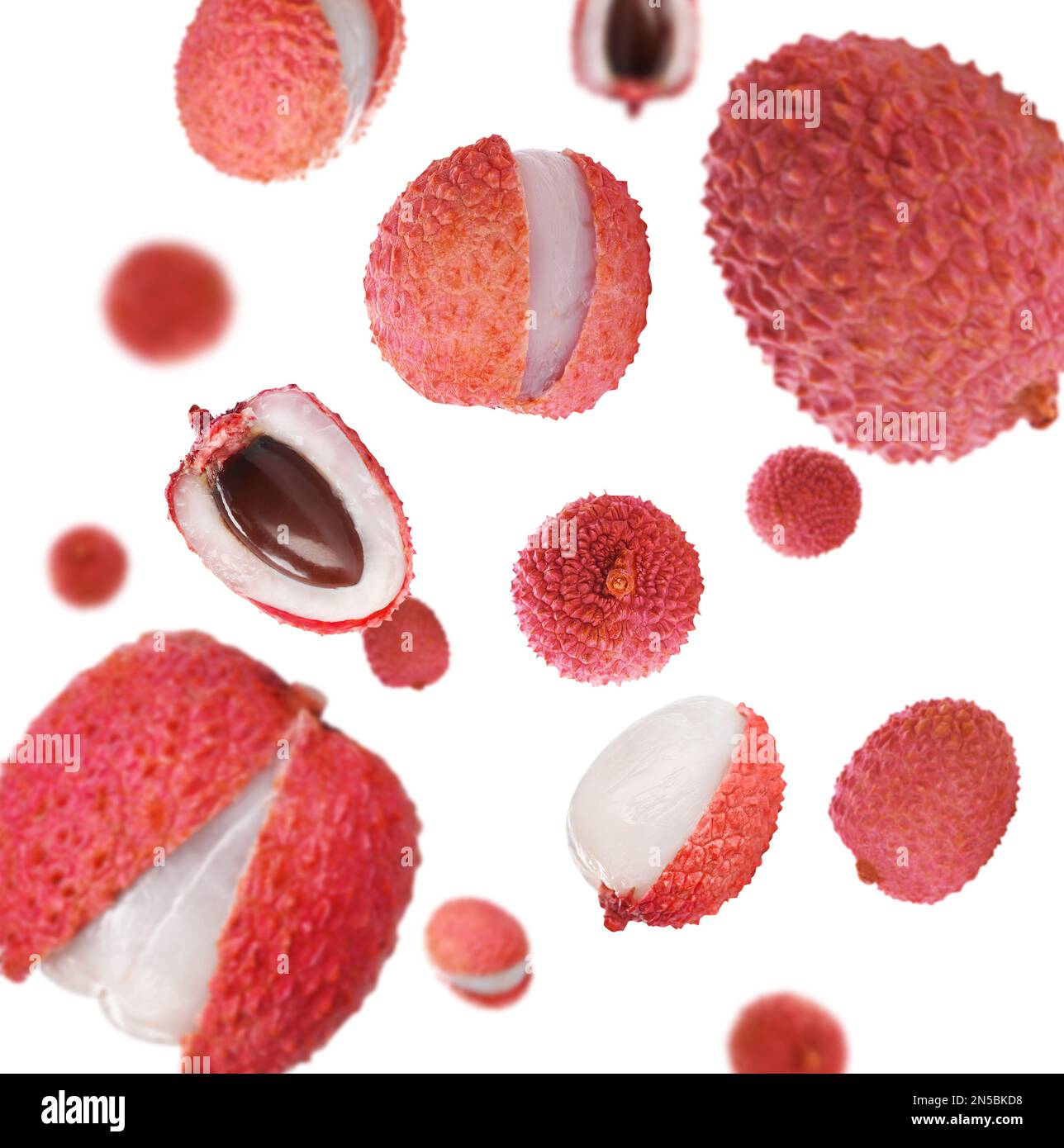 Set of falling delicious lychees on white background Stock Photo - Alamy