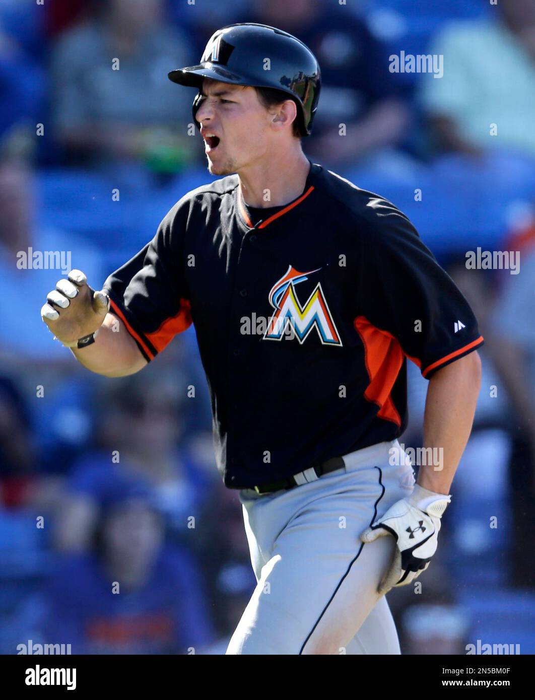 Miami Marlins' Rob Brantly celebrates after scoring on a wild pitch by ...