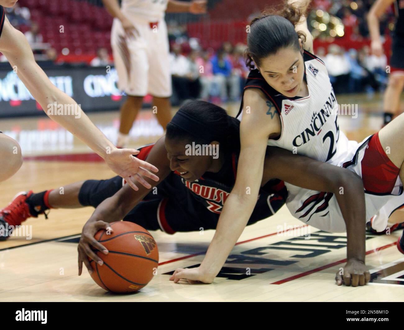 Louisville forward Asia Taylor (31) goes for the ball against ...