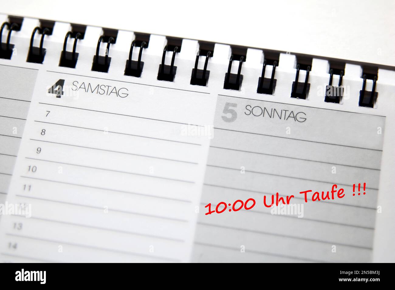 desk calendar in German with entry baptism Stock Photo - Alamy
