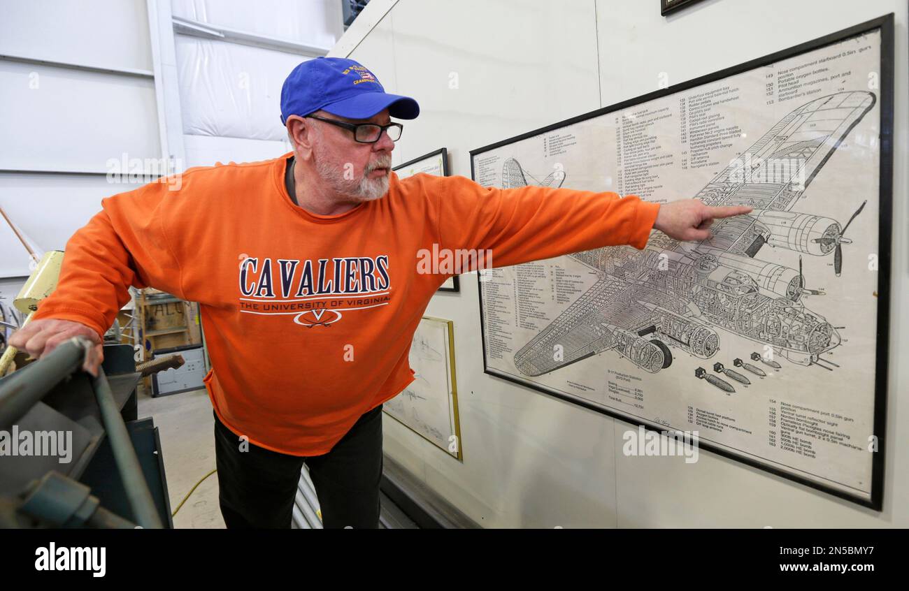 Volunteer Dave Weatherman points to the part of a B-17 World War II-era ...