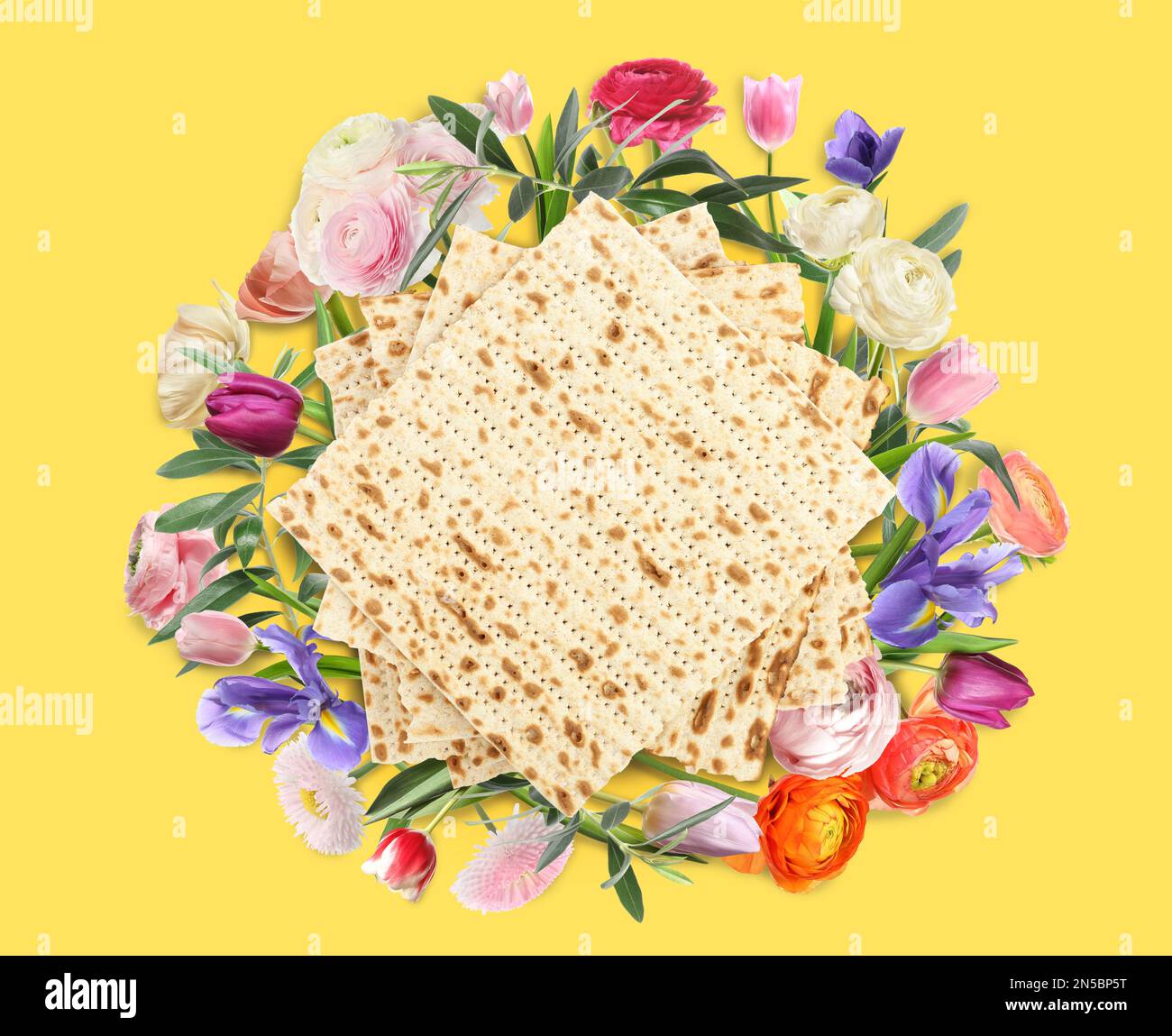 Tasty matzos and flowers on yellow background, flat lay. Passover ...