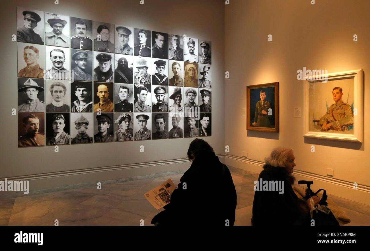 Visitors view at an exhibition entitled 'The Great War in Portraits' at ...