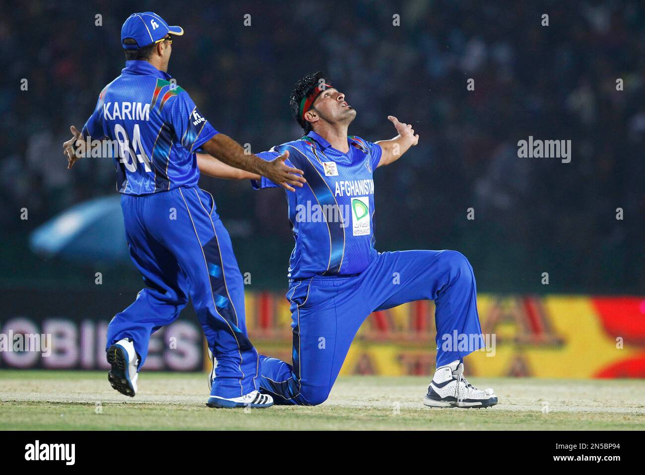 Afghanistan’s Hamid Hassan, right, and his teammate Karim Sadiq ...