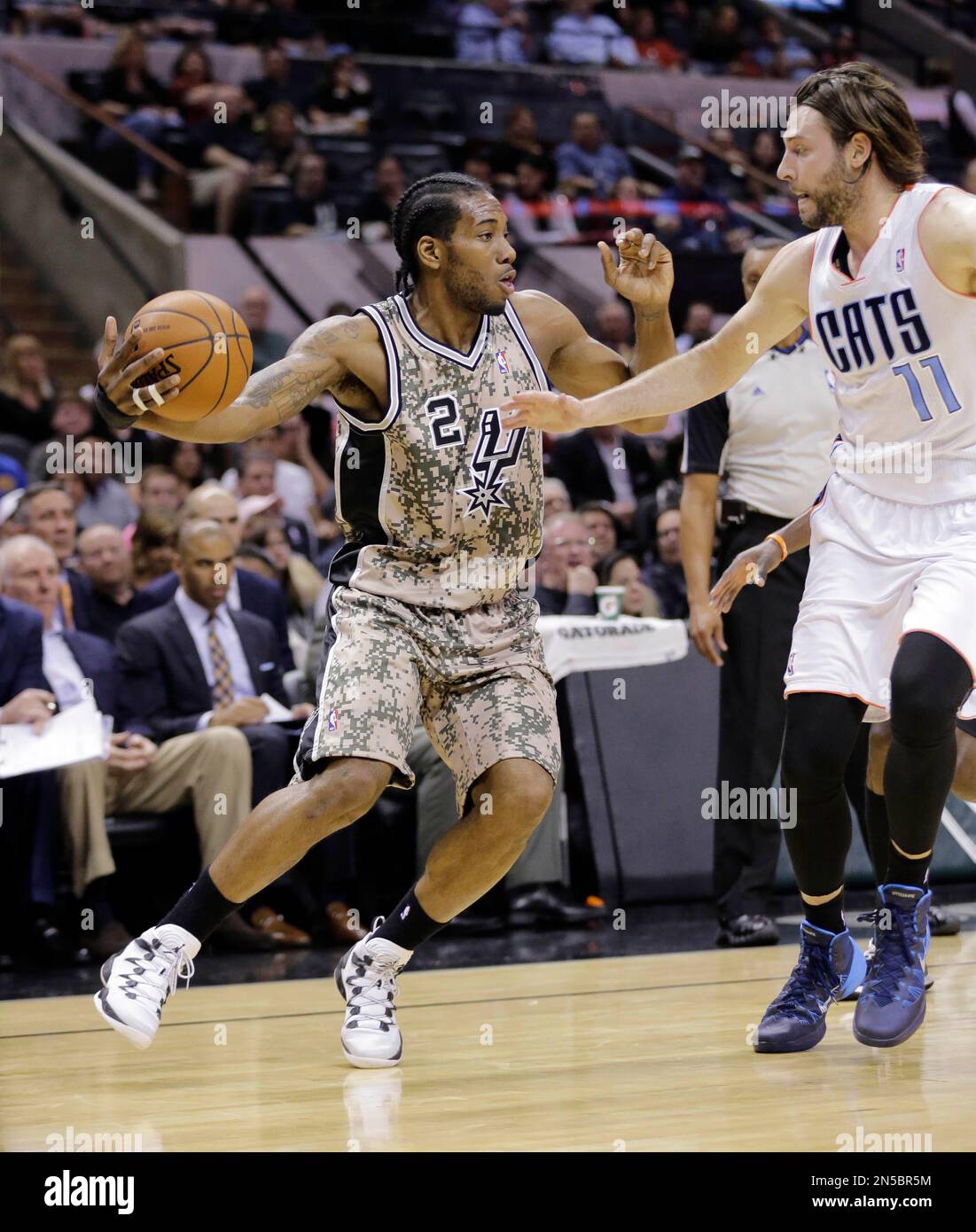 San Antonio Spurs' Kawhi Leonard (2) and Charlotte Bobcats' Josh ...