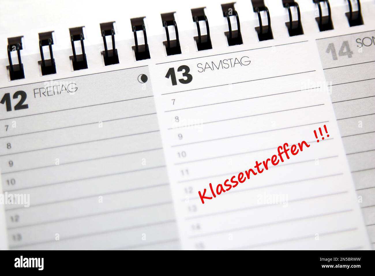 desk calendar in German with entry class reunion Stock Photo - Alamy