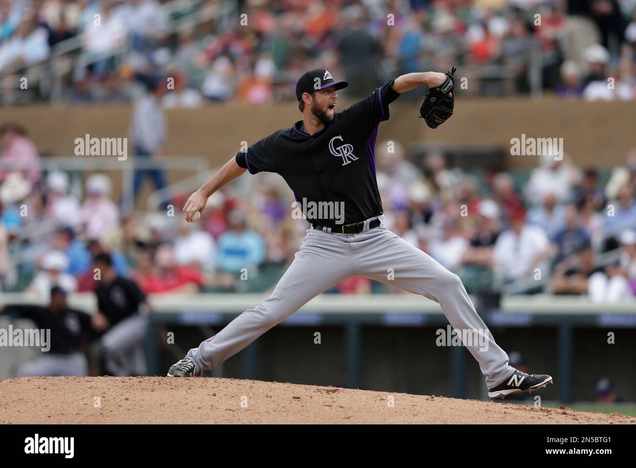 Colorado Rockies relief pitcher Chris Martin throws against the Arizona ...