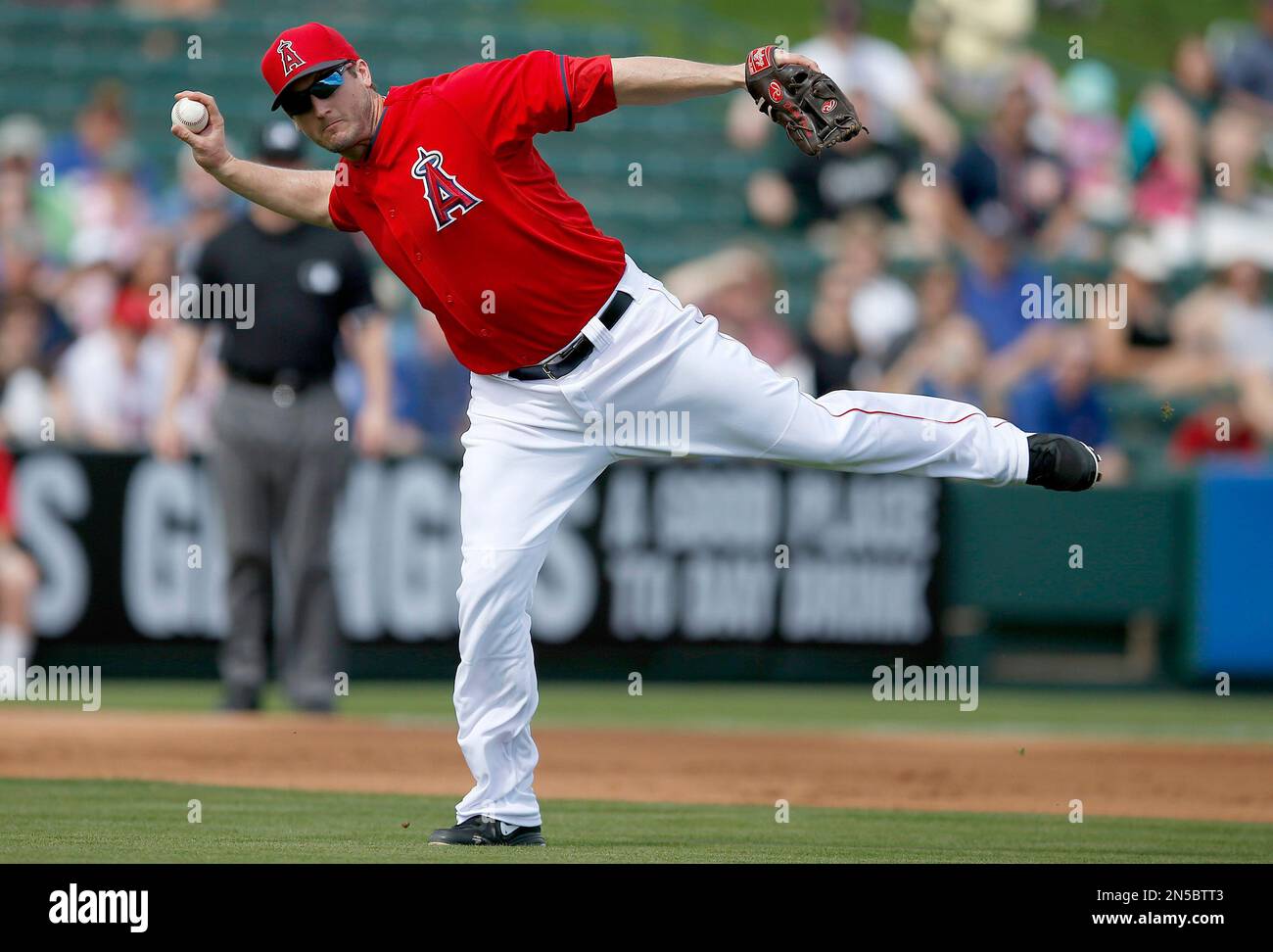 Los Angeles Angels' David Freese leans over as he gets ready to throw ...