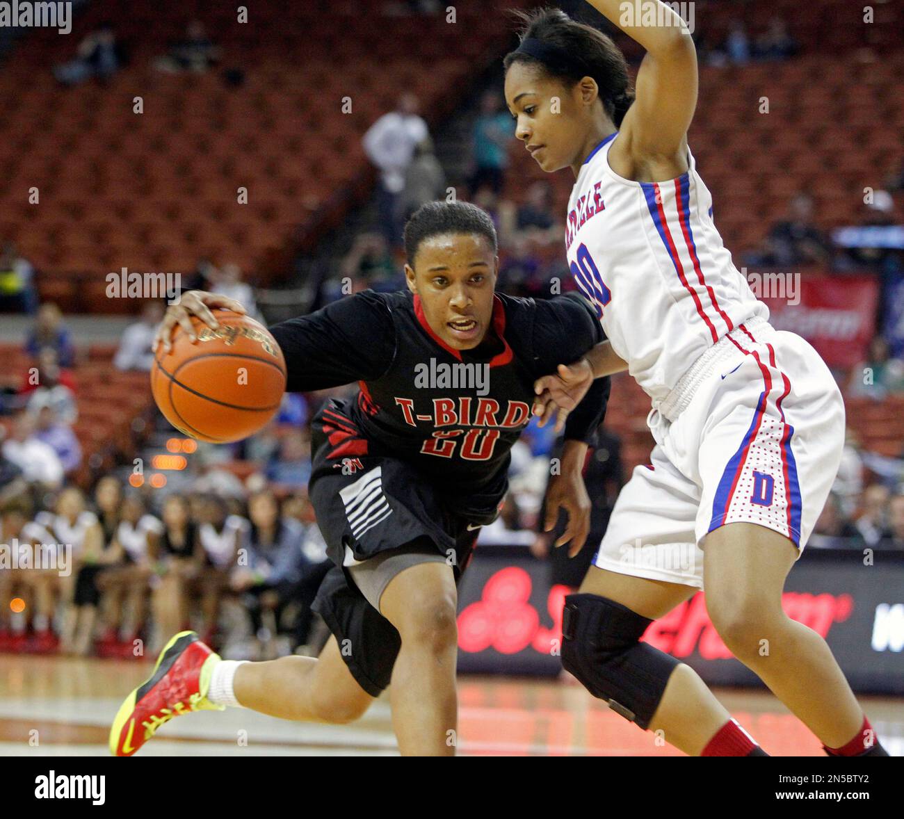 San Antonio Wagner guard Ashley Dunn (20) drives against Duncanville ...