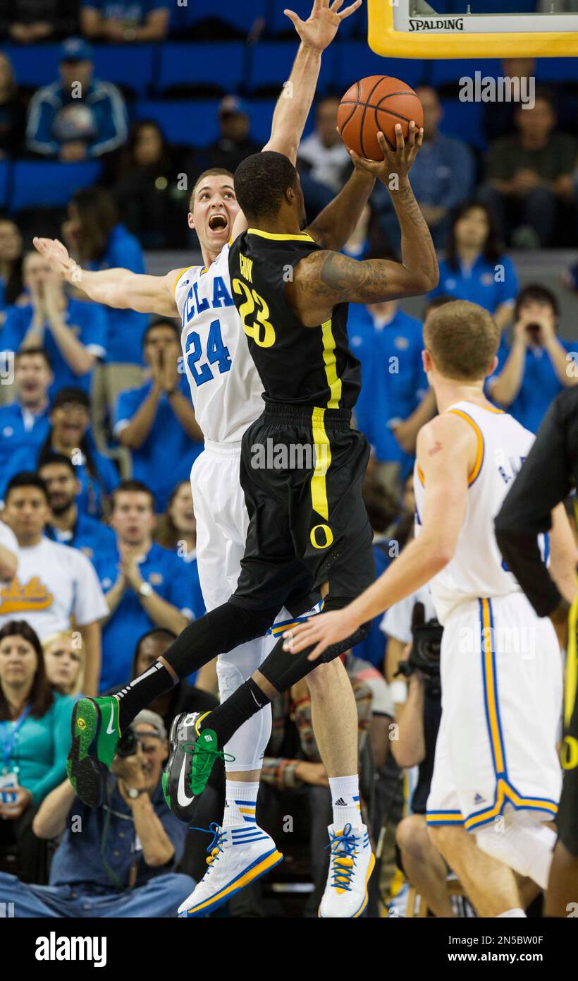 Oregon forward Elgin Cook #23, and UCLA forwards Travis Wear #24, in ...