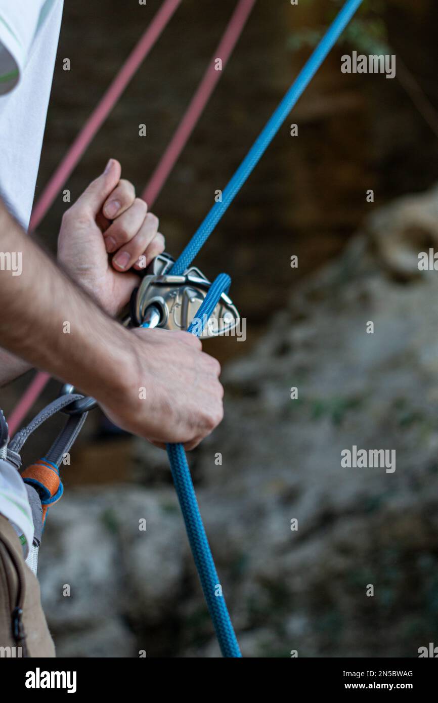 A closeup of climber holding rope Stock Photo - Alamy