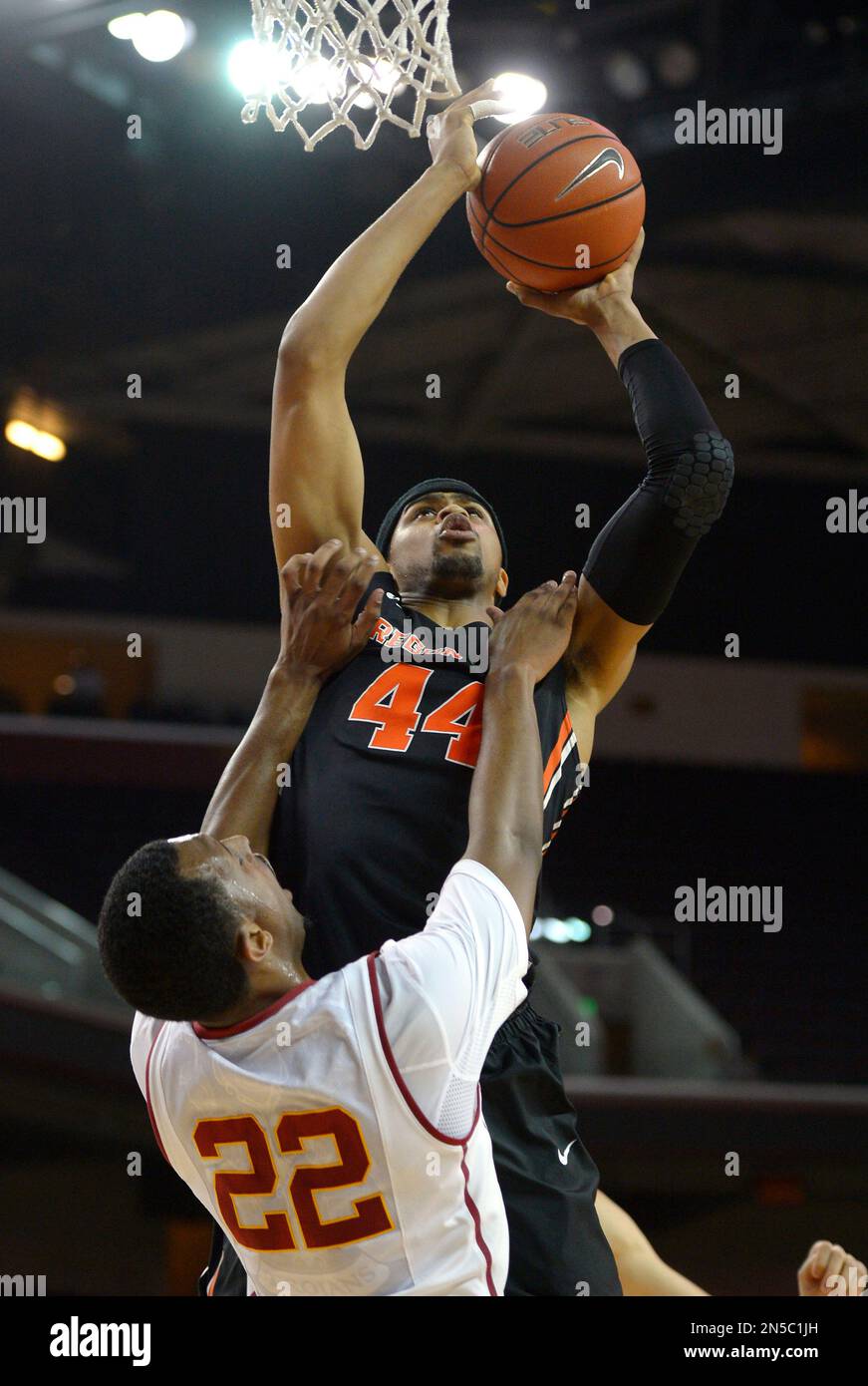 Oregon State forward Devon Collier, top, goes up for a shot as USC ...