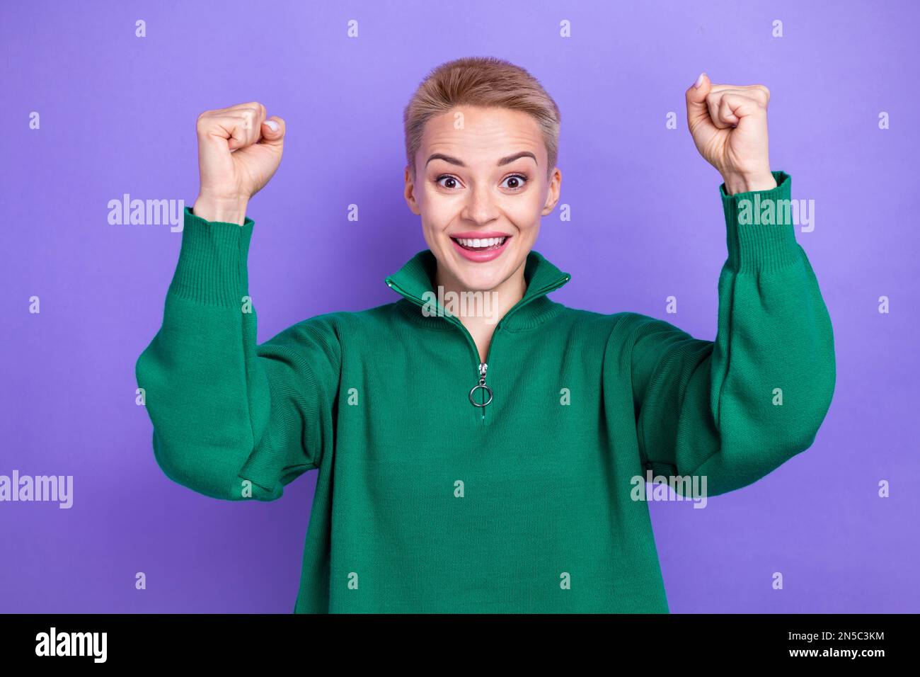 Photo of excited overjoyed prize winner woman fists up celebrate ...
