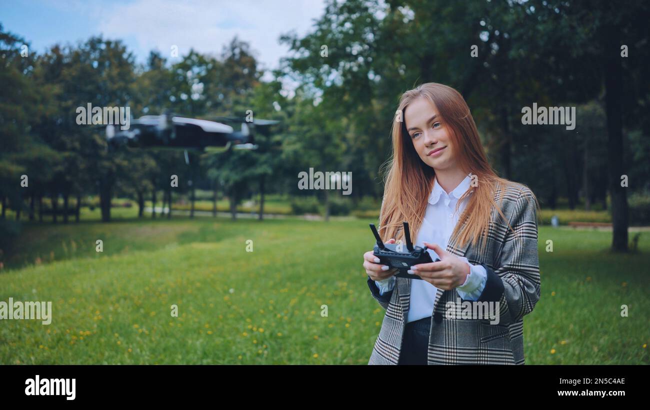 Asian female flying a drone hi-res stock photography and images - Alamy