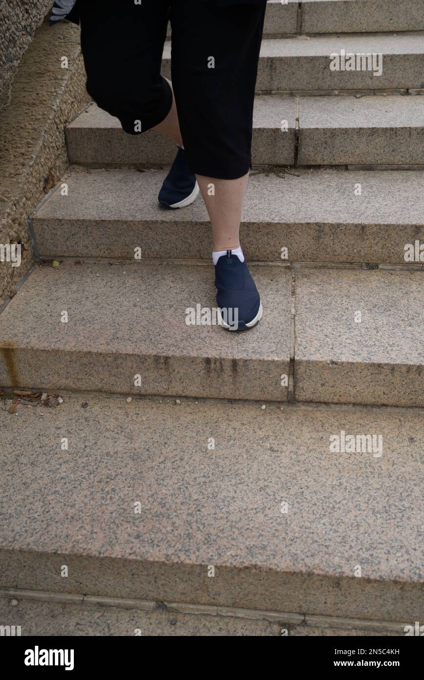 Walking down steps Stock Photo - Alamy