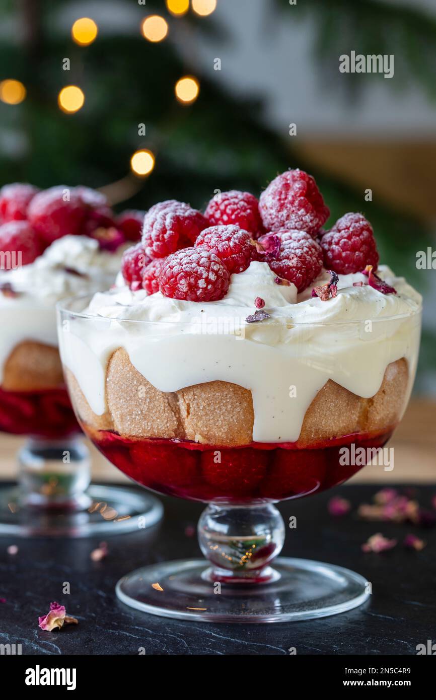 Raspberry trifle with fruit jelly, custard and cream Stock Photo - Alamy